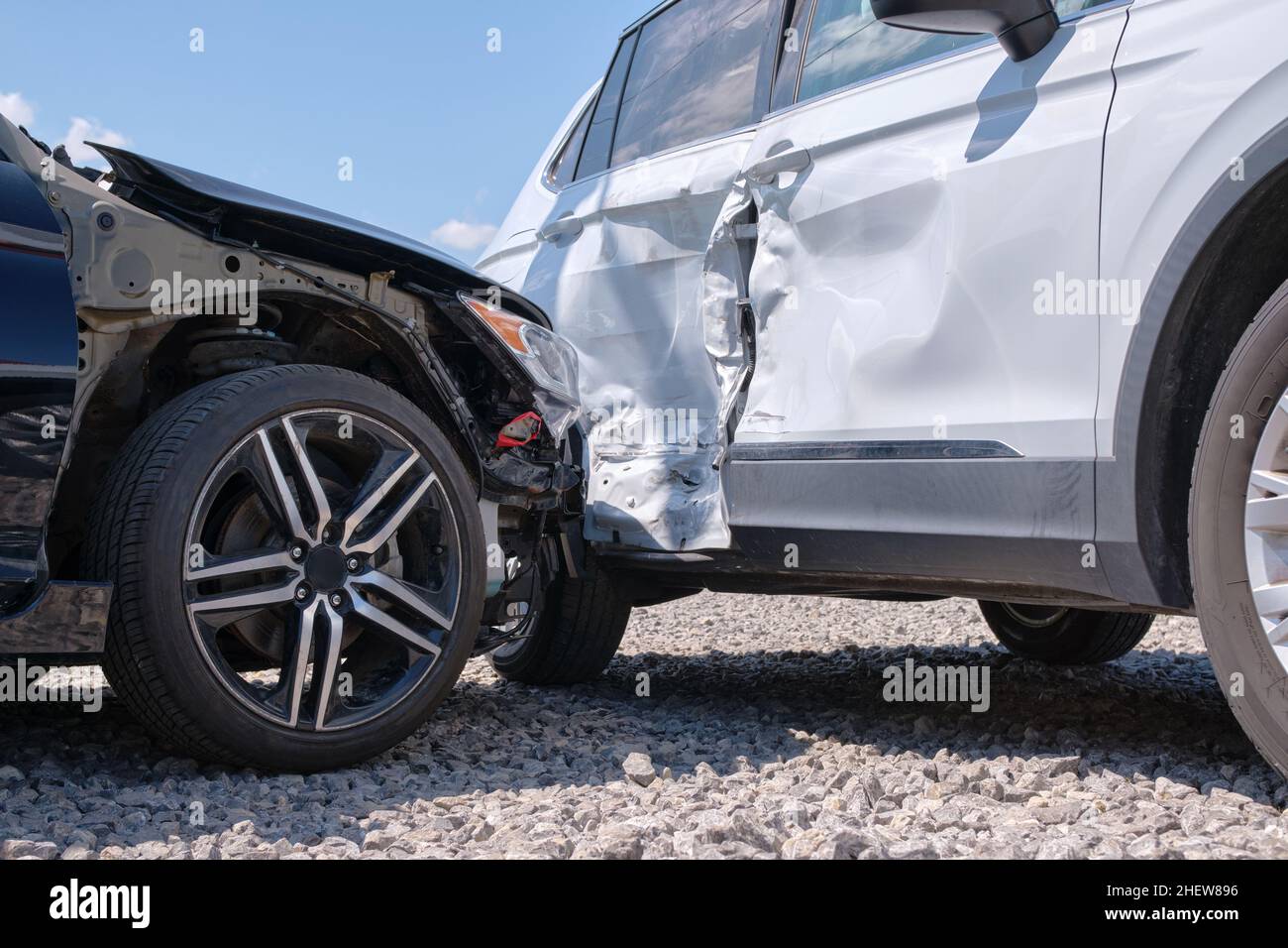 Damaged in heavy car accident vehicles after collision on city street ...