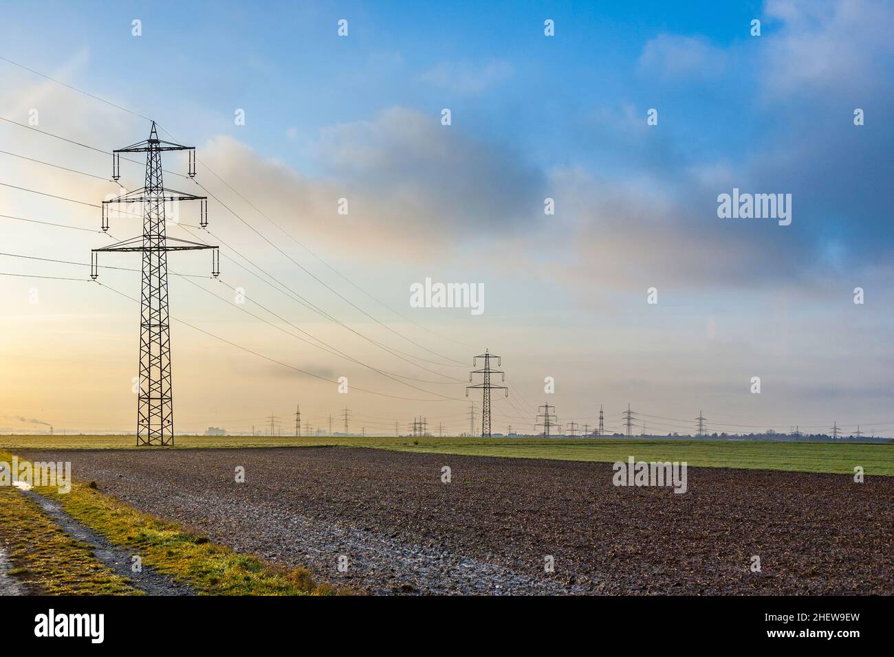 electrical tower in landscape with dark clouds Stock Photo - Alamy