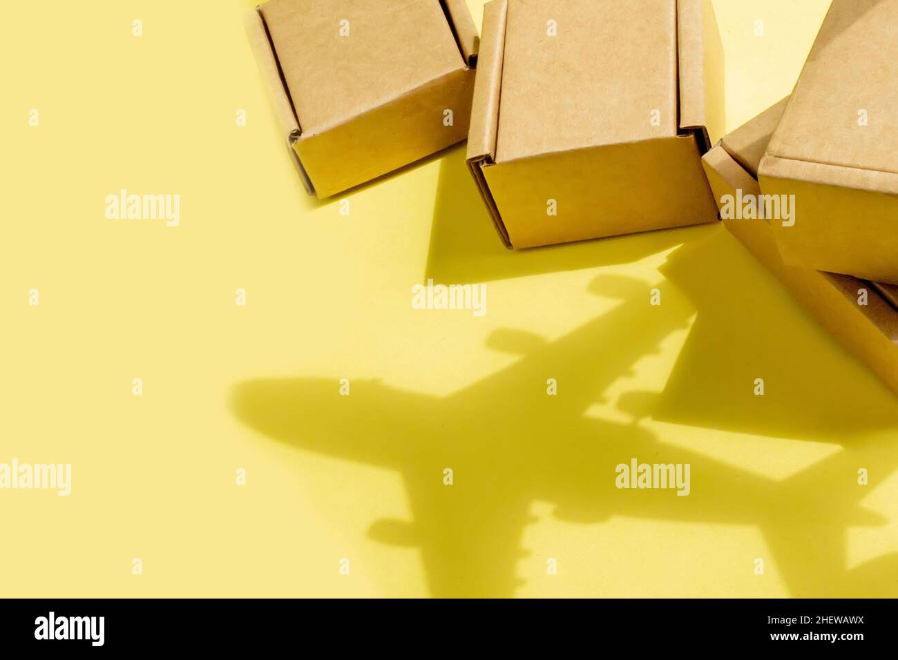 Shadow Airplane and stack of cardboard boxes. concept of air cargo and ...