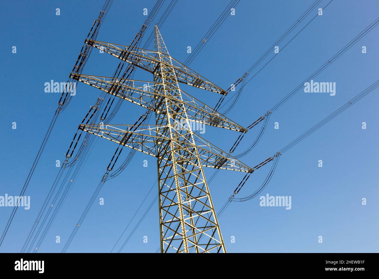 electric pylon with blue sky Stock Photo - Alamy