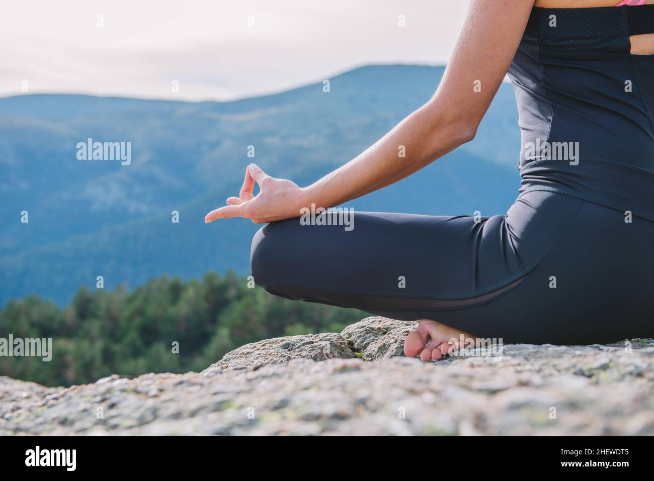 woman meditating yoga mountain postures Stock Photo - Alamy