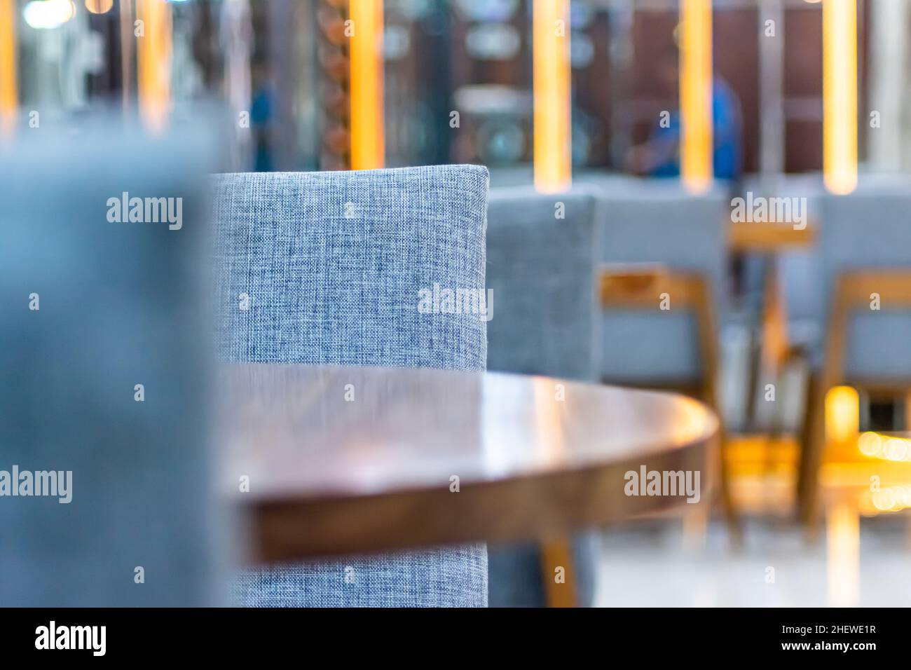 cozy and comfort blue seat with the brown wood table with the warm ...