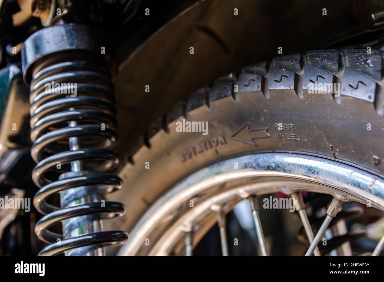 Back side of vintage motorcycle showing metallic steel spoke wheels ...