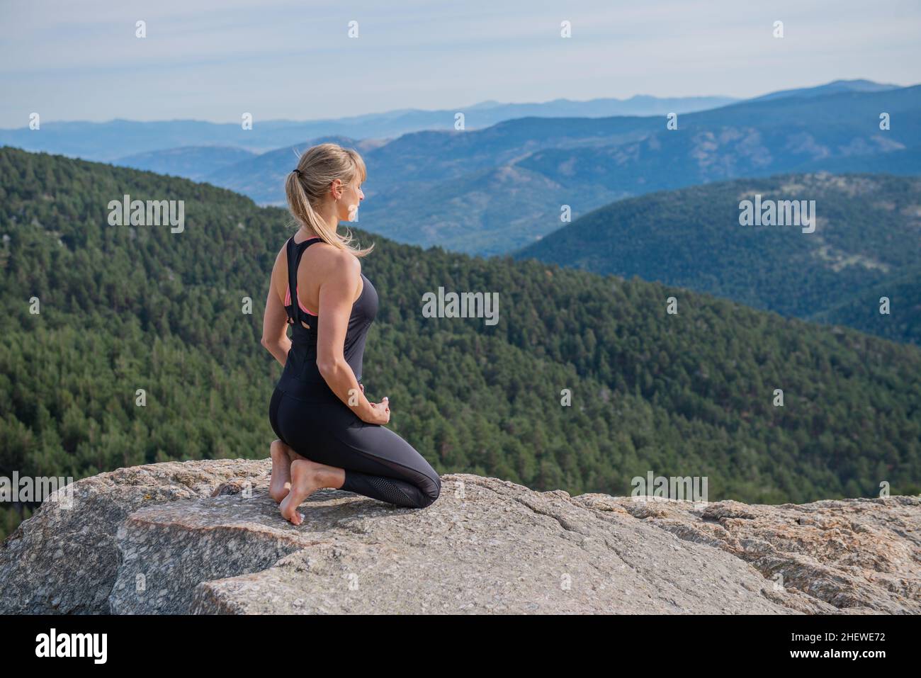 woman meditating yoga mountain postures Stock Photo - Alamy