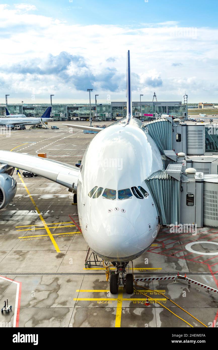 Loading of a big passenger aircraft at the gate without logos Stock ...