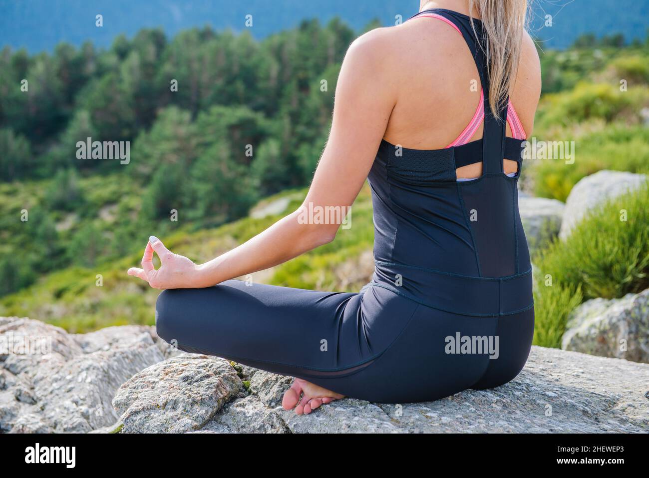 woman meditating yoga mountain postures Stock Photo - Alamy