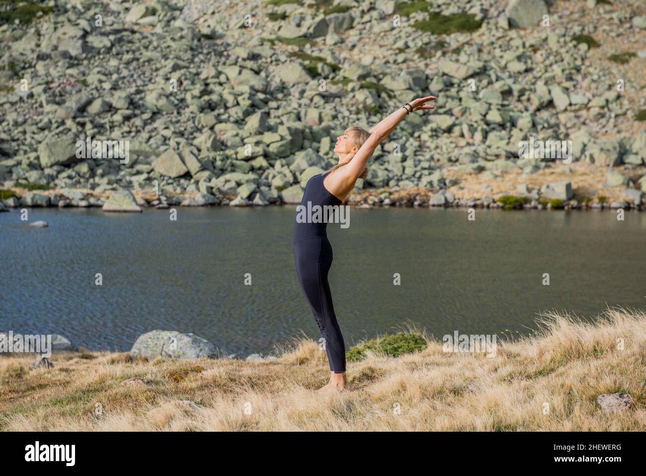 yoga poses woman mountain Stock Photo - Alamy