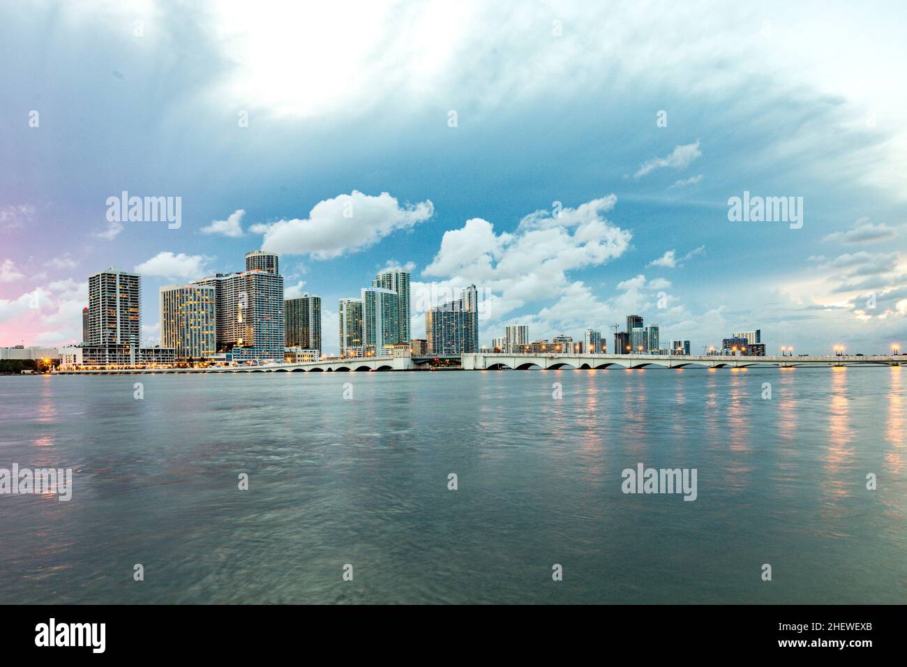 Miami city skyline panorama at dusk with urban skyscrapers and bridge ...