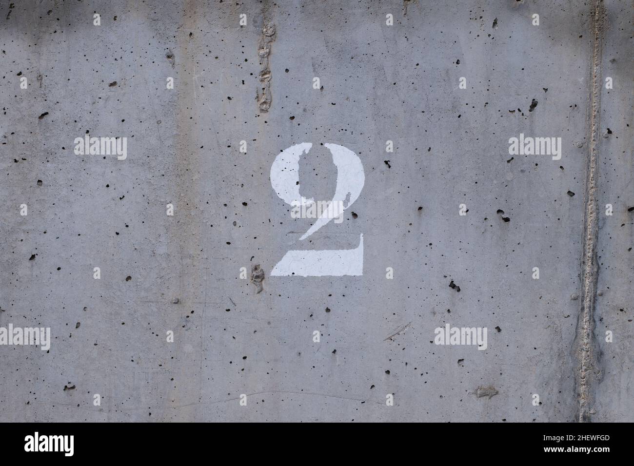 number 2 painted on a worn concrete wall Stock Photo - Alamy