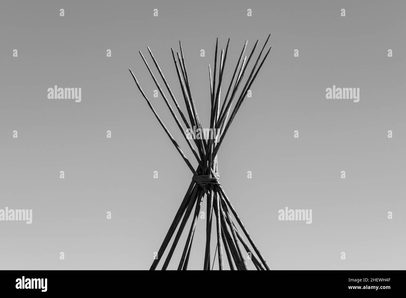 Teepee sticks with clear sky in black and white Stock Photo - Alamy