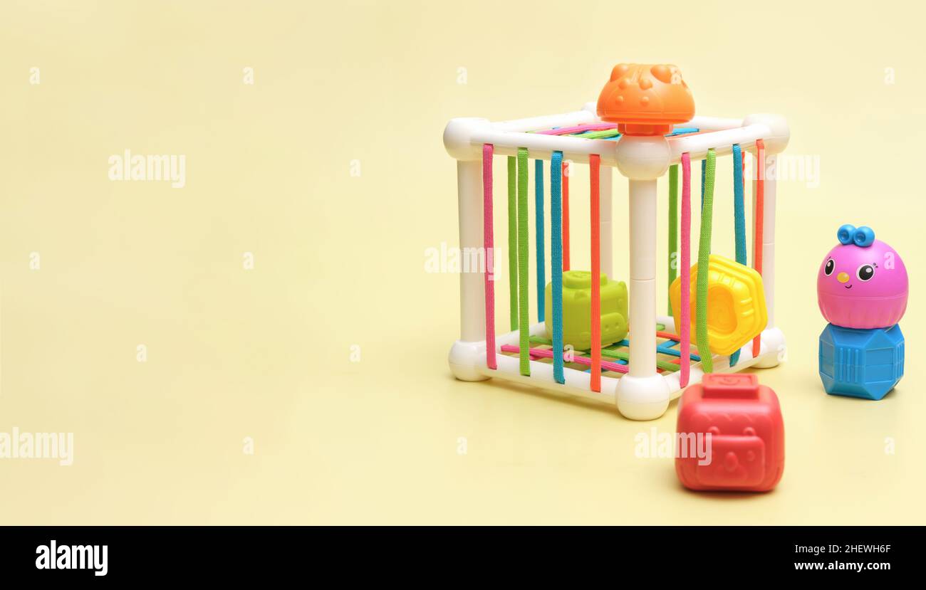 baby educational toy - a multi-colored cube. Development of fine motor ...
