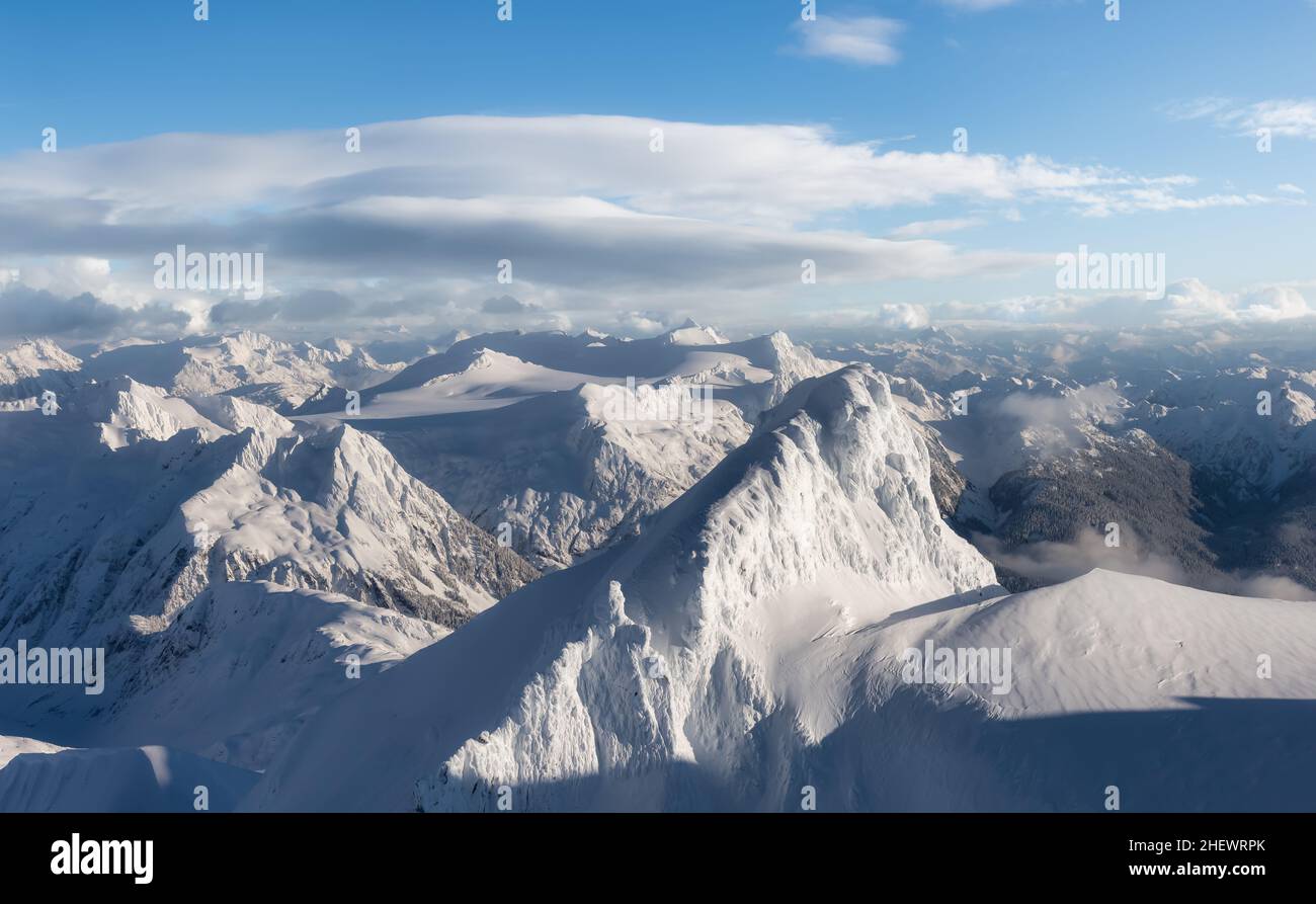 Aerial Panoramic View of Canadian Mountain covered in snow Stock Photo ...