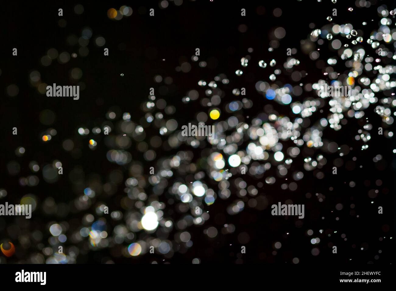 Abstract bokeh texture on black background Stock Photo - Alamy
