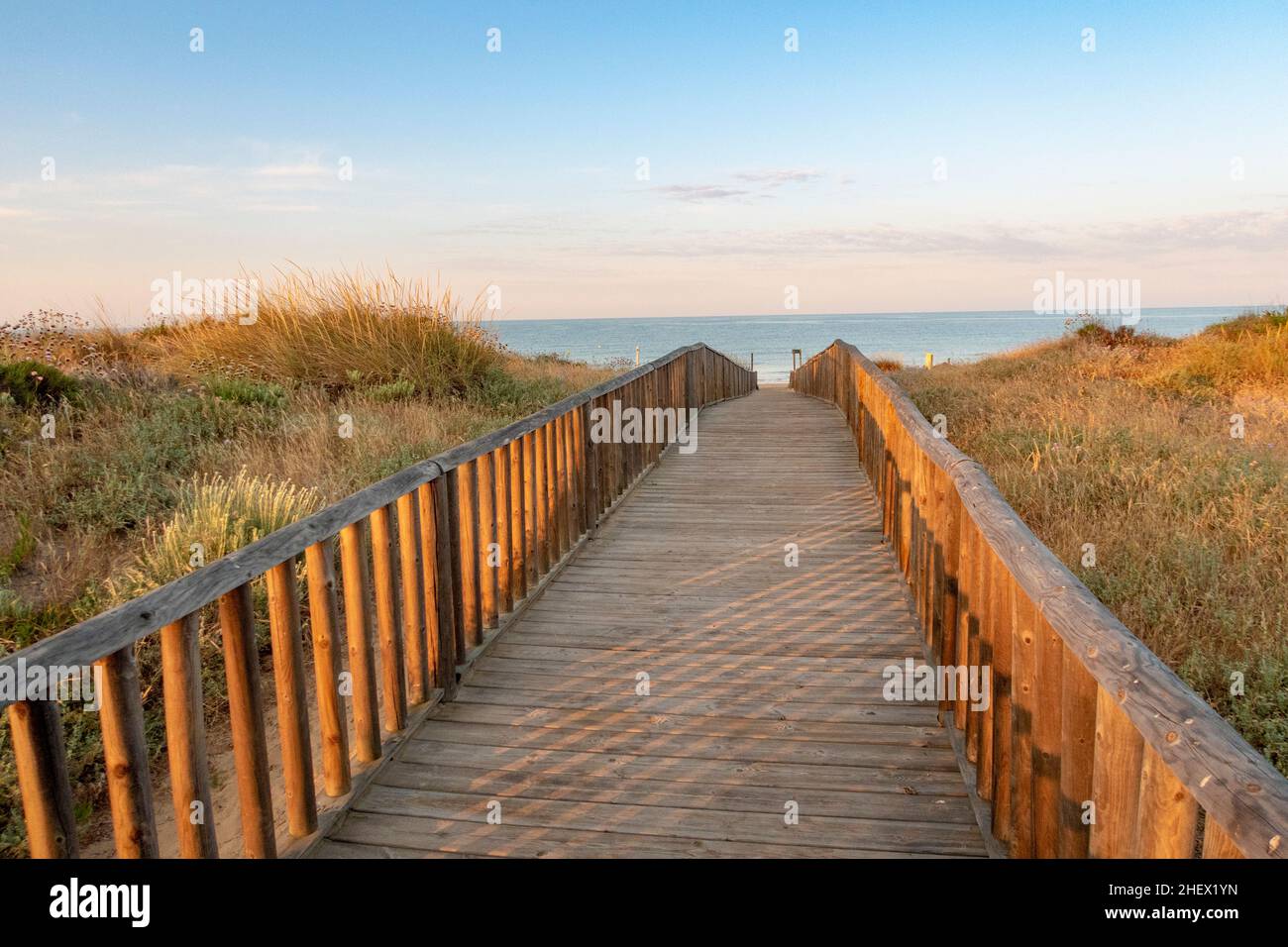 romantic sunrise at the beach in Andalusia, spain with dune Stock Photo ...