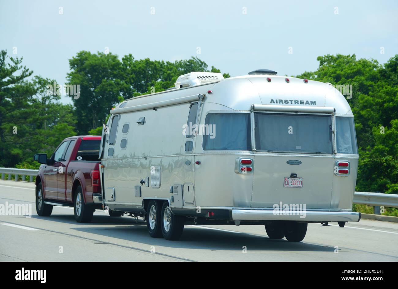 Kentucky U.S.A - August 20, 2021 - A white RV pulled by a red pick up ...