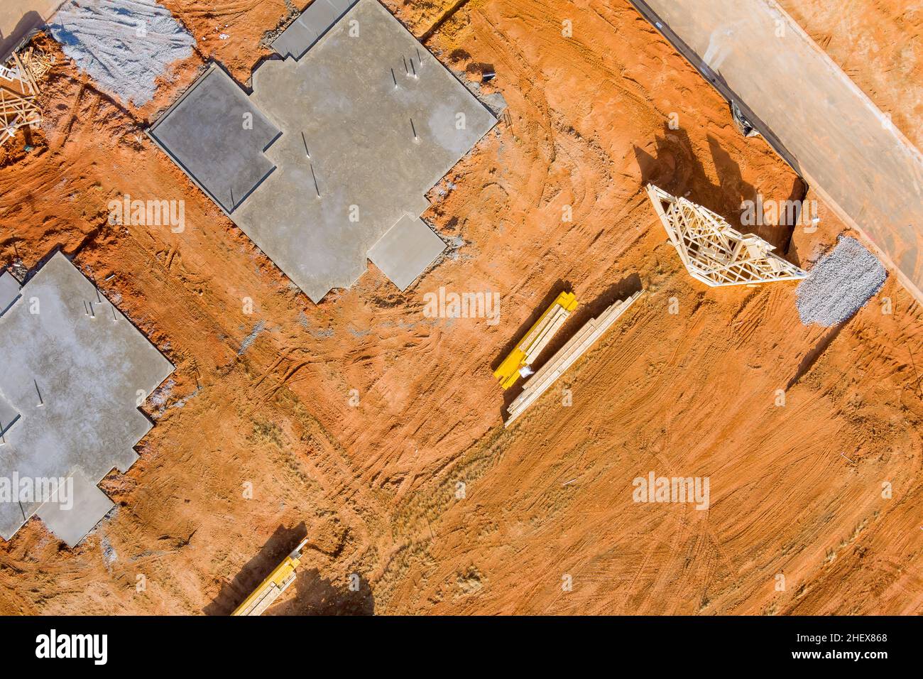 Building site of trenches dug in ground and filled with cement as ...