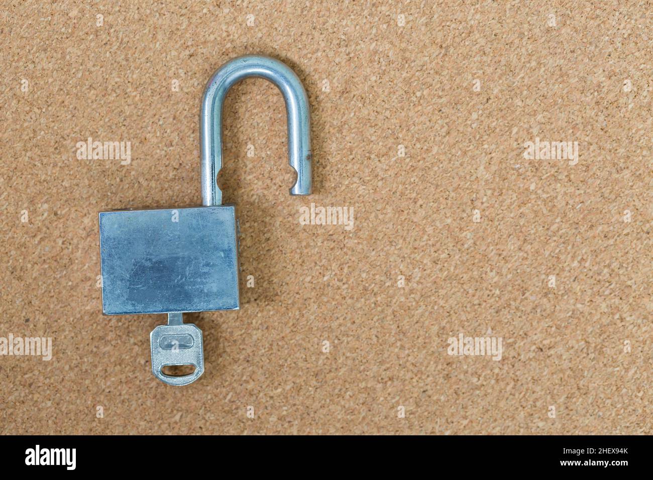 Old master key and key lock on cork board background Stock Photo - Alamy
