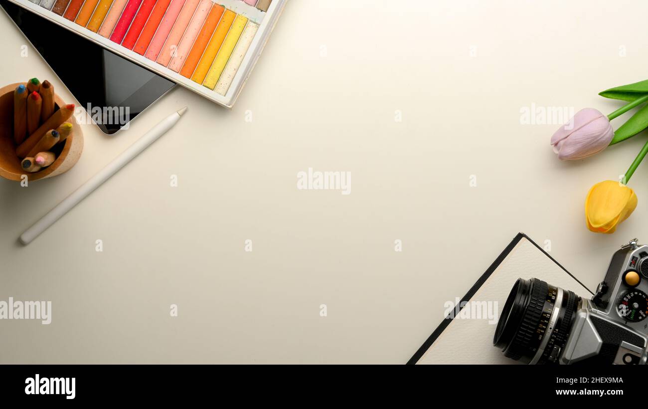 Freelance photographer office desk with work tools, camera and copy ...