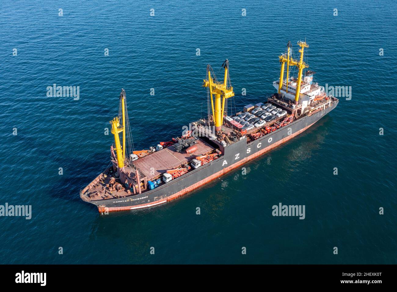 Sea cargo ship loaded with cars and equipment Stock Photo - Alamy