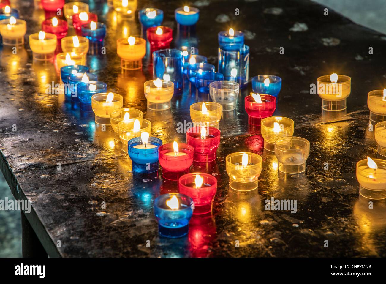 an ernest wish symbolized by church candles Stock Photo - Alamy