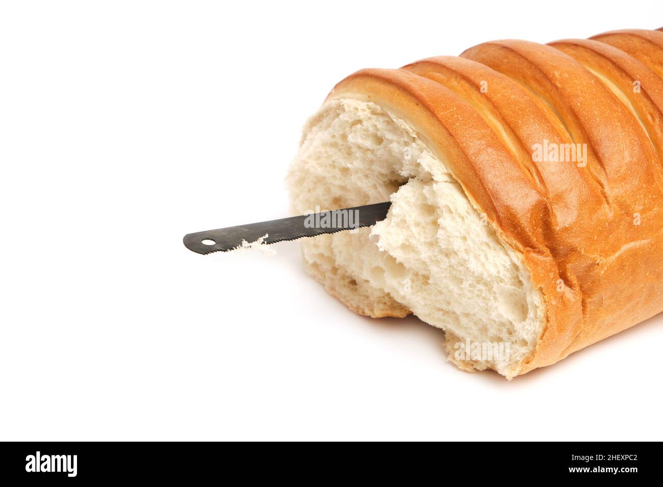 Loaf loaf broken in half, with hacksaw for metal inside.Tool, concept ...