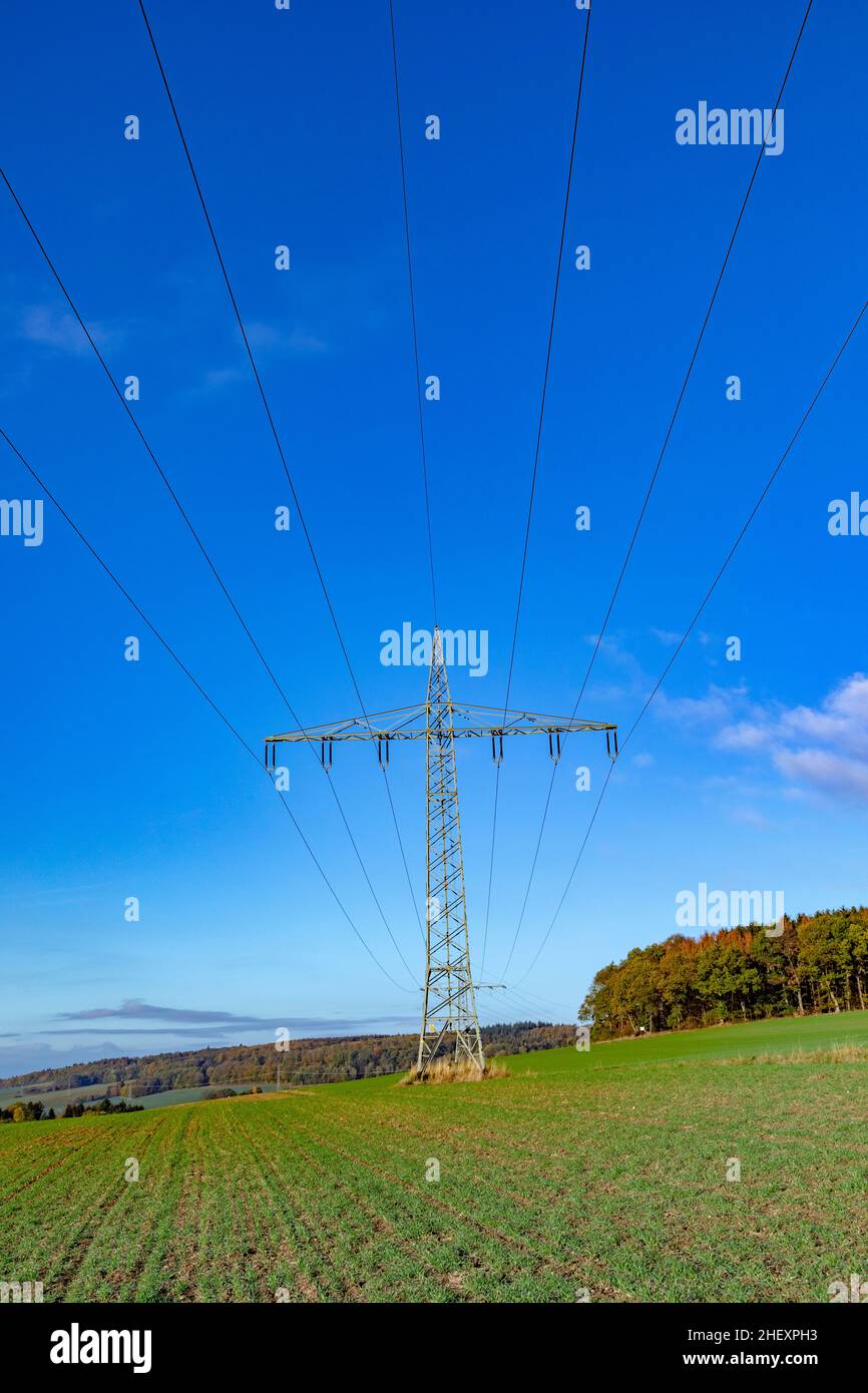 electric pylon under clear blue sky Stock Photo - Alamy