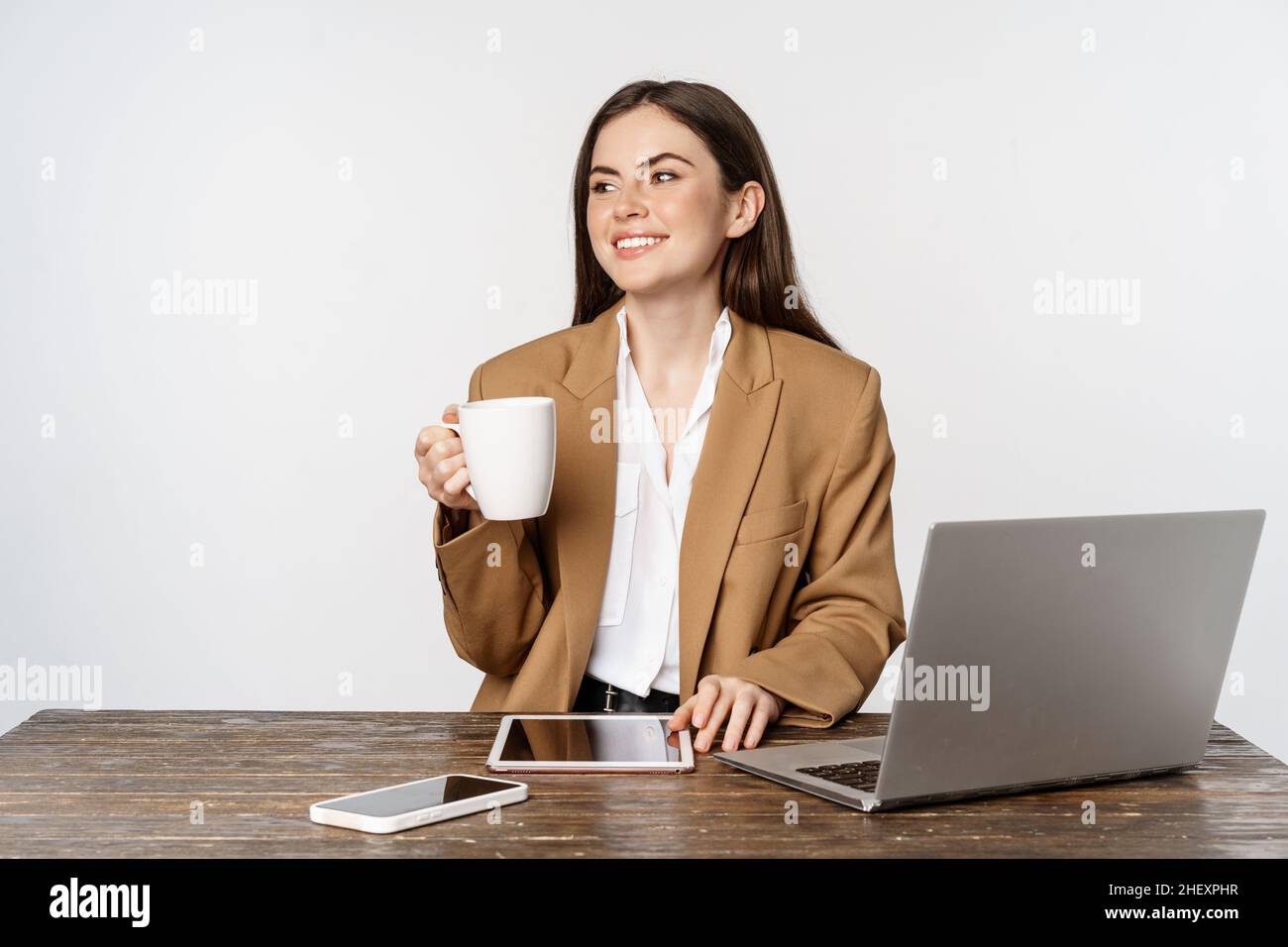 Beautiful happy office lady, business woman drinking coffee at work ...