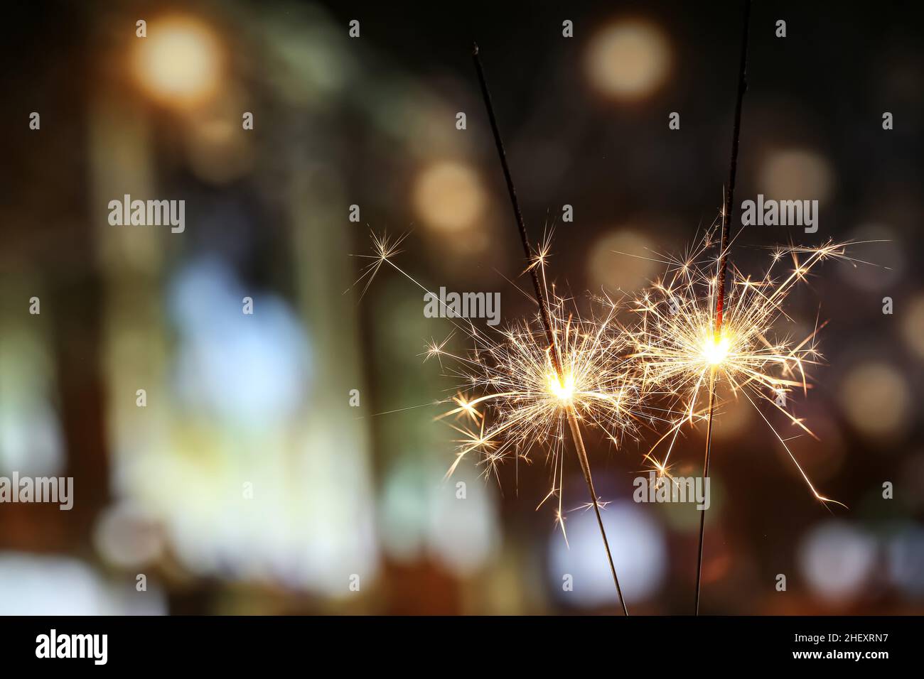 Beautiful sparklers at night city Stock Photo - Alamy