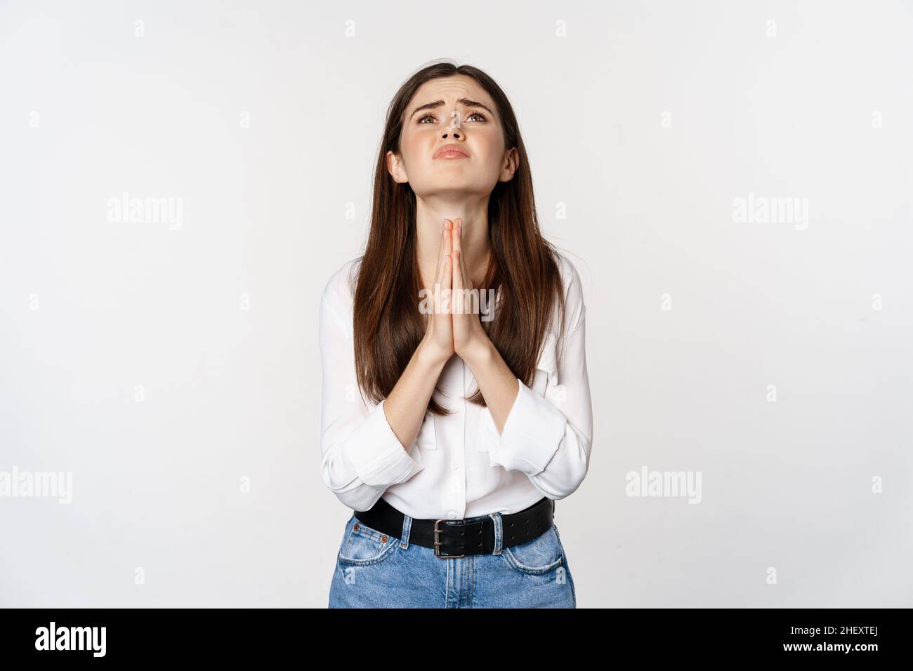 Desperate woman pleading, begging and looking up in sky, supplicating ...