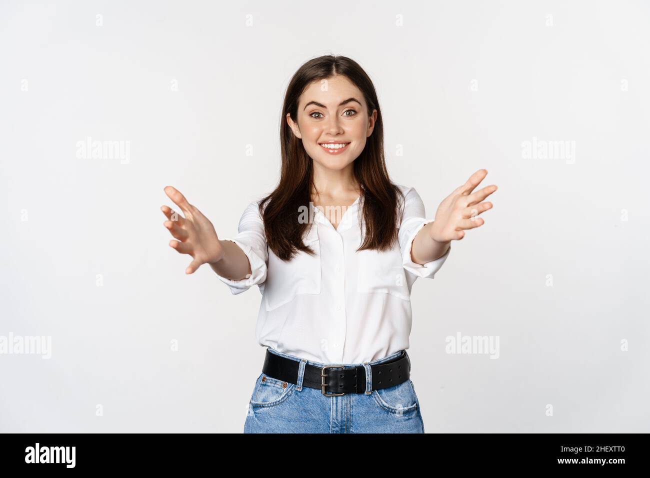 Enthusiastic laughing woman, smiling and stretching out arms forward ...