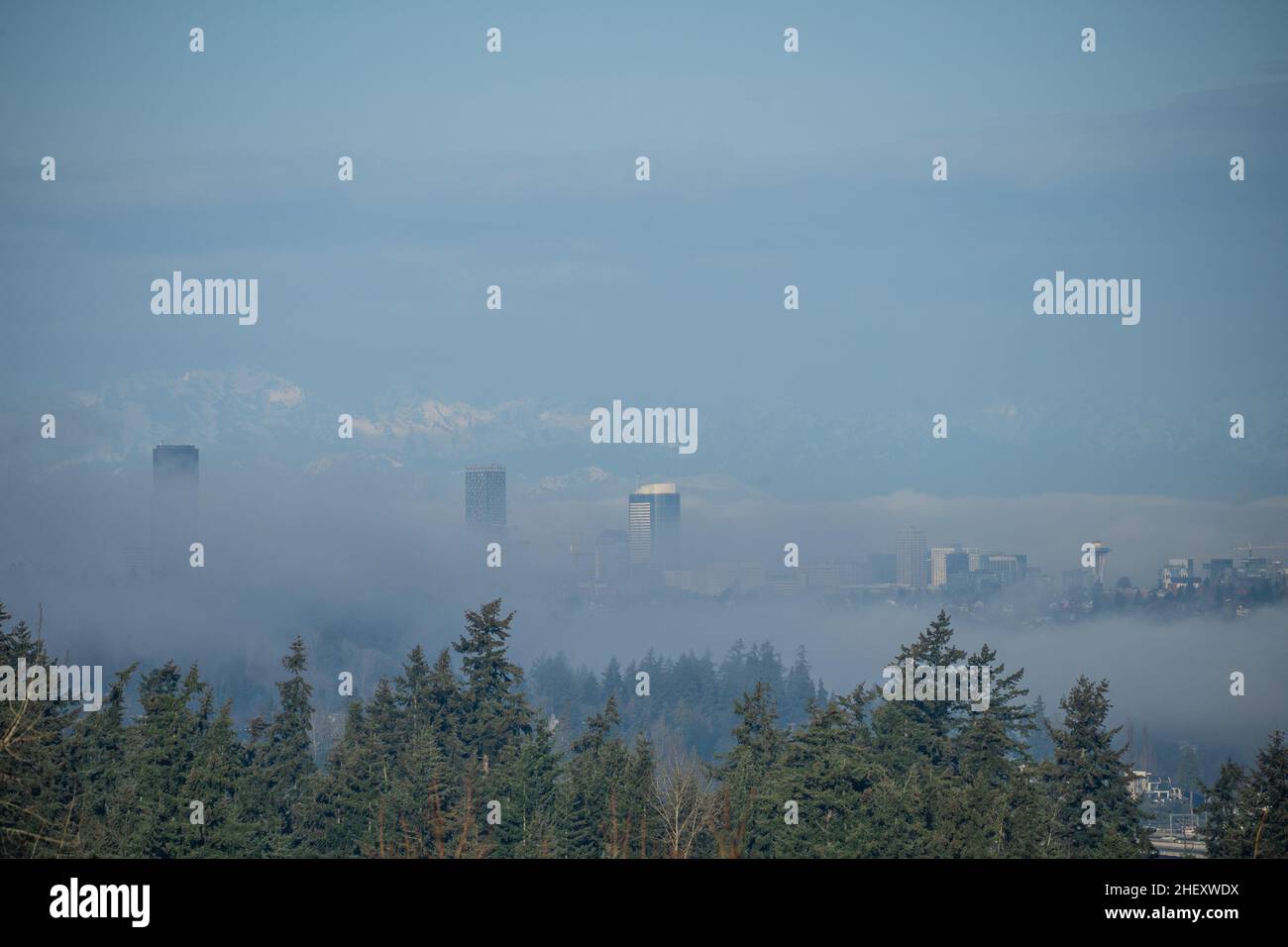 Seattle skyline covered with morning fog on sunny day Stock Photo - Alamy