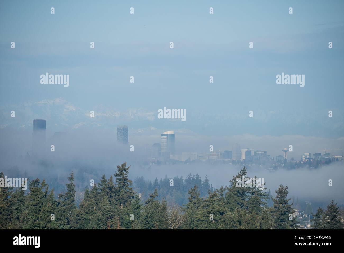 Seattle skyline covered with morning fog on sunny day Stock Photo - Alamy