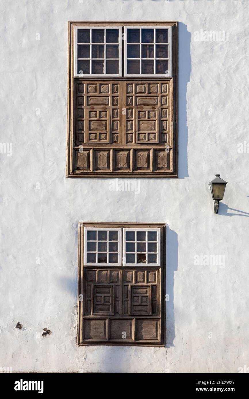 typical wooden windows at the whitewashed facade of a house in rural ...