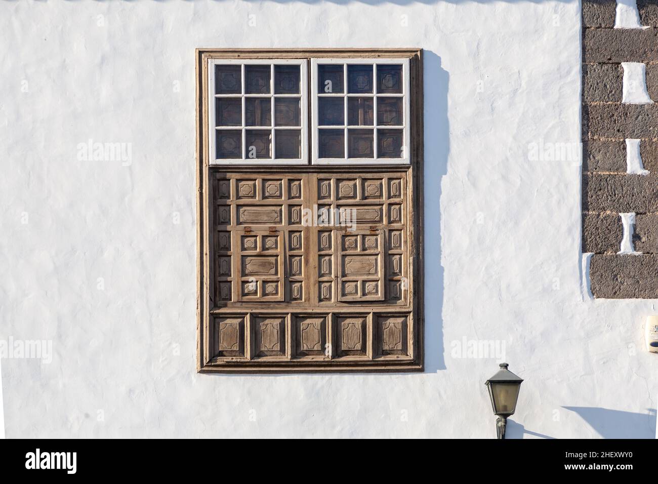 typical wooden windows at the whitewashed facade of a house in rural ...