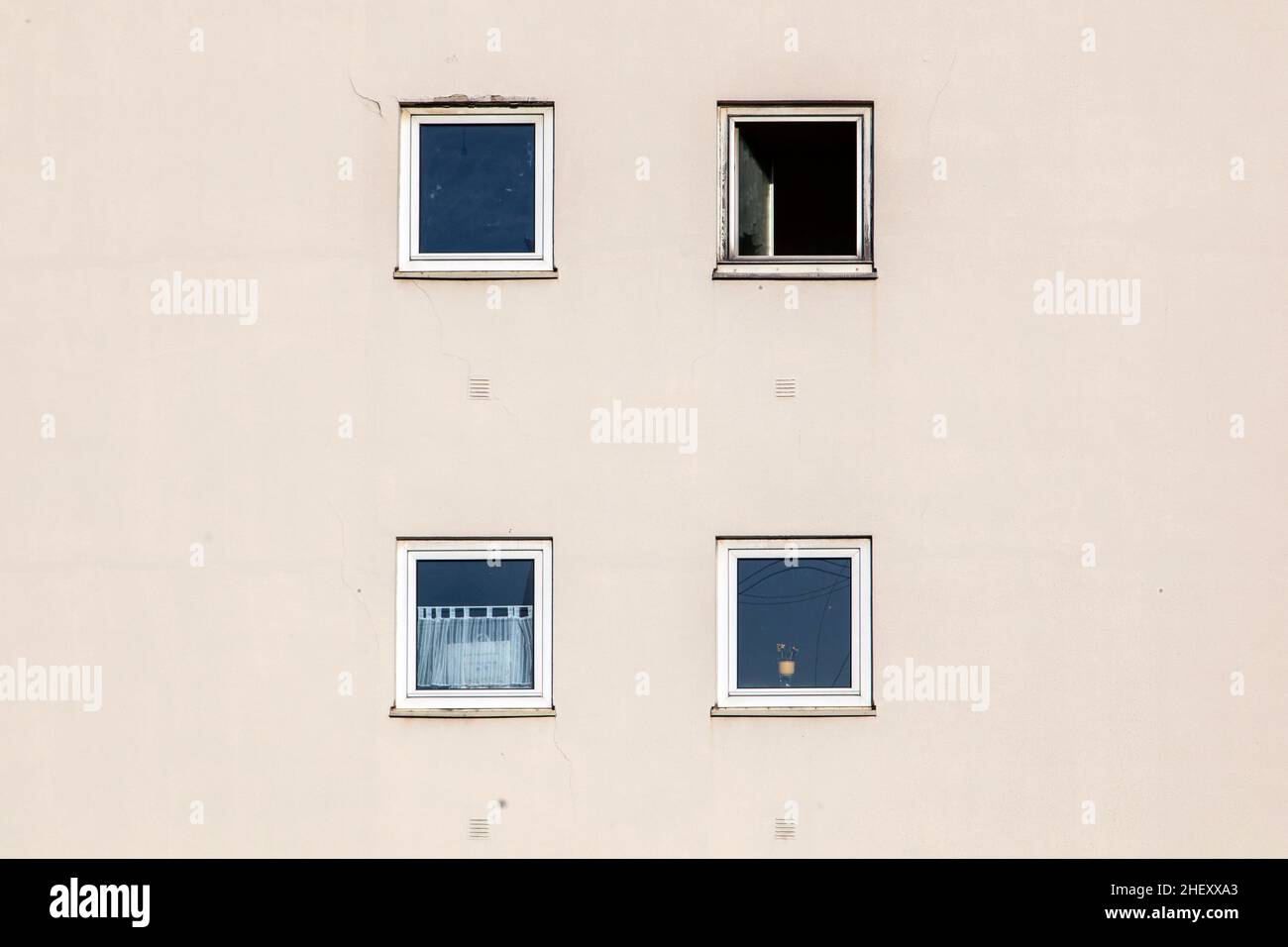 facade of house with four windows in detail Stock Photo - Alamy