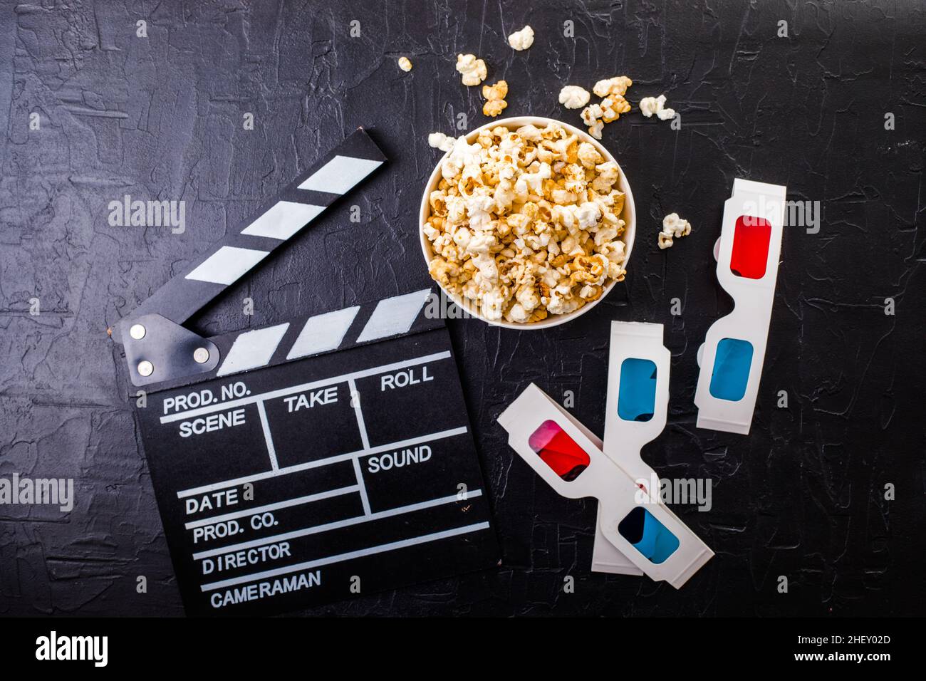 Cinema minimal concept. popcorn, 3d glasses clapper board on black ...