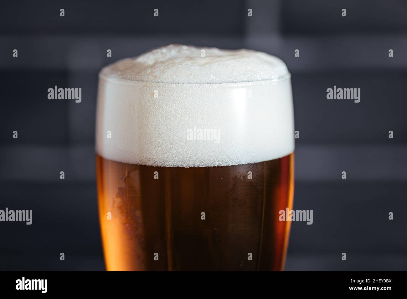 Glass of beer with foam and four different snacks Stock Photo - Alamy