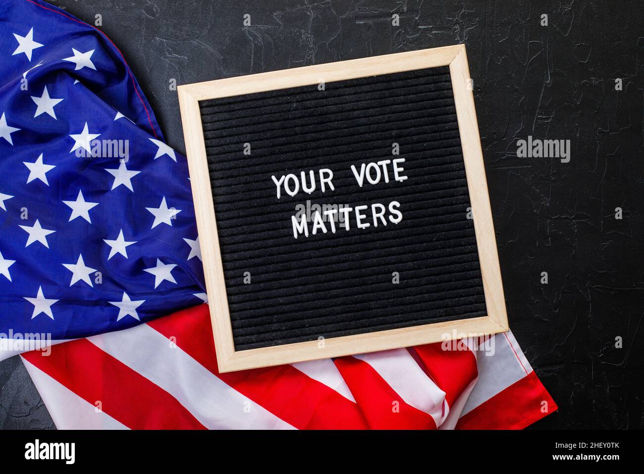 Letterboard sign with the words your vote matters with American flag on ...