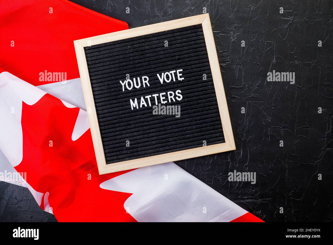 Letterboard sign with the words your vote matters with Canada flag on ...