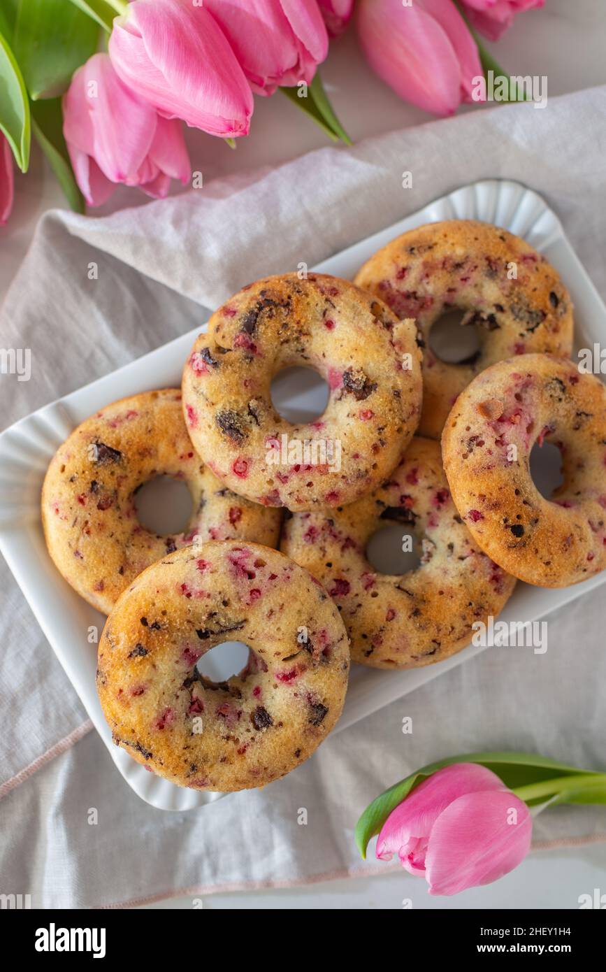 chocolate raspberry donuts Stock Photo - Alamy