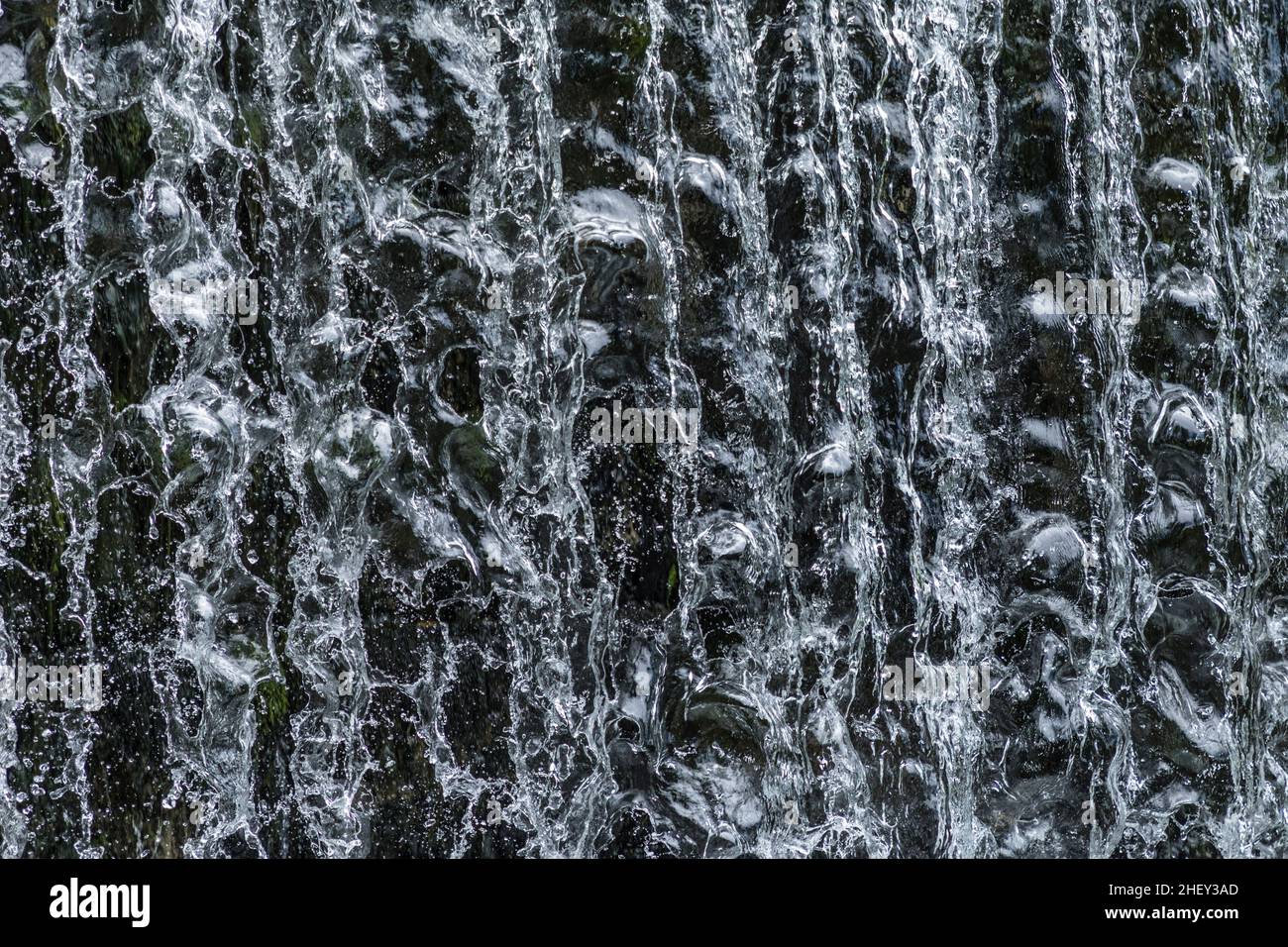 pattern of flowing water at a waterfall gives a harmonic background ...