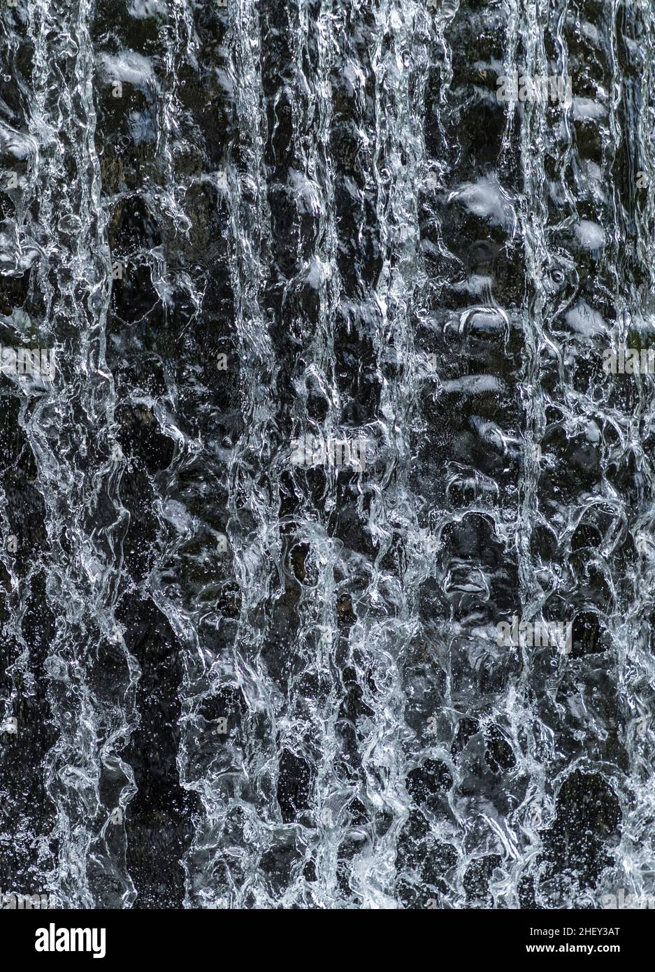 pattern of flowing water at a waterfall gives a harmonic background ...