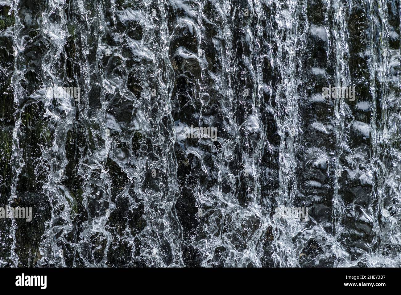 pattern of flowing water at a waterfall gives a harmonic background ...