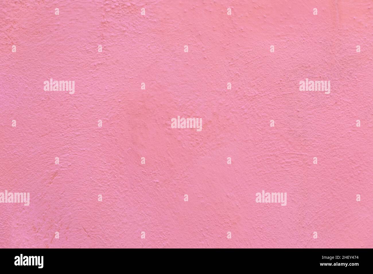 typical painted pink plaster wall of an old house in the provence Stock ...