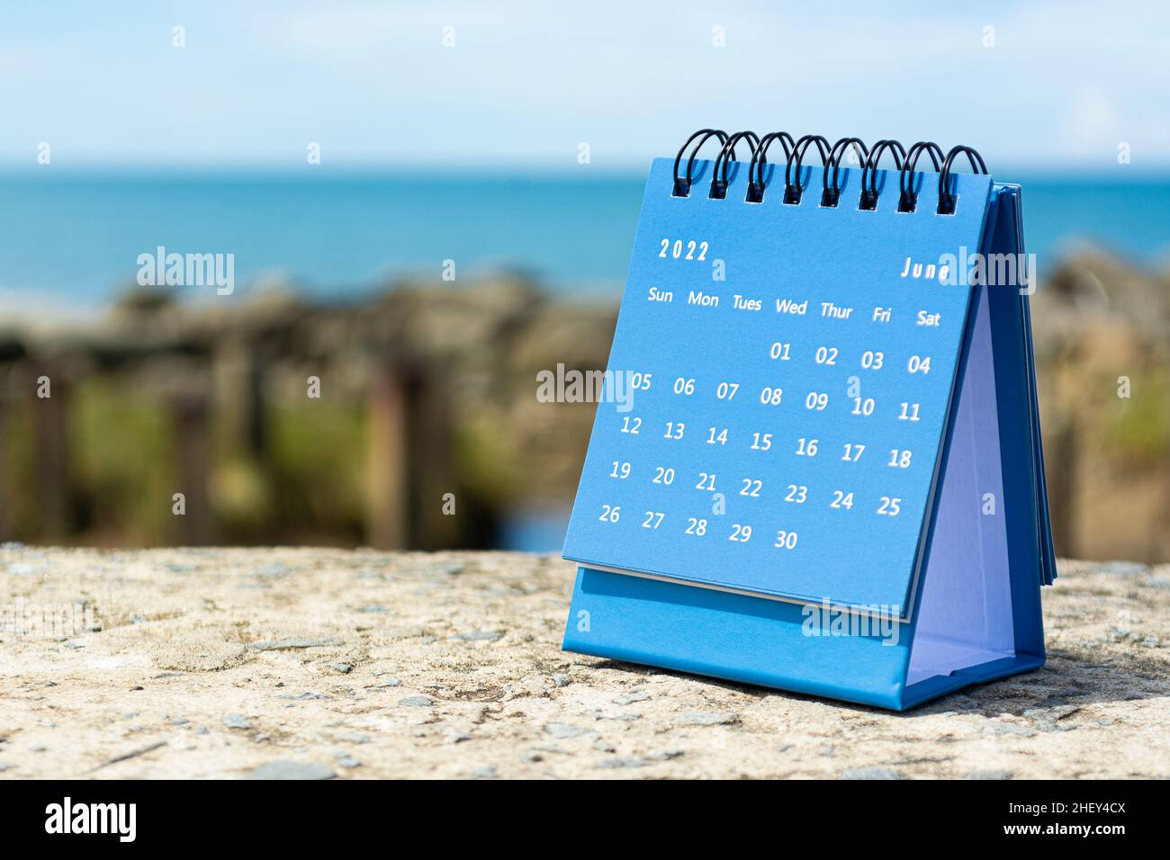 Blue June 2022 calendar on blurred background of blue ocean. 2022 New ...