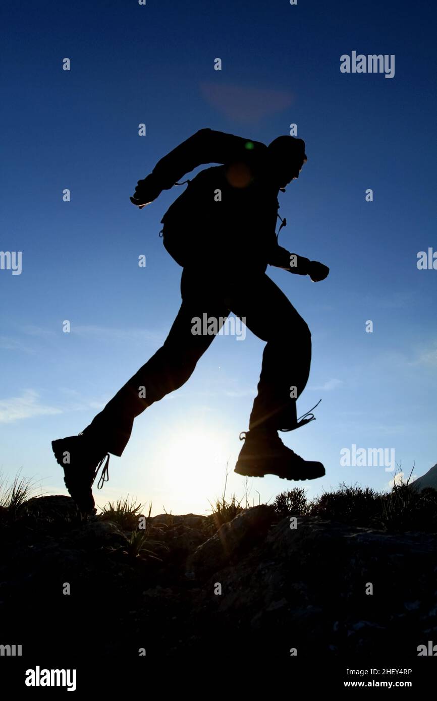 Man running up a mountain hi-res stock photography and images - Alamy