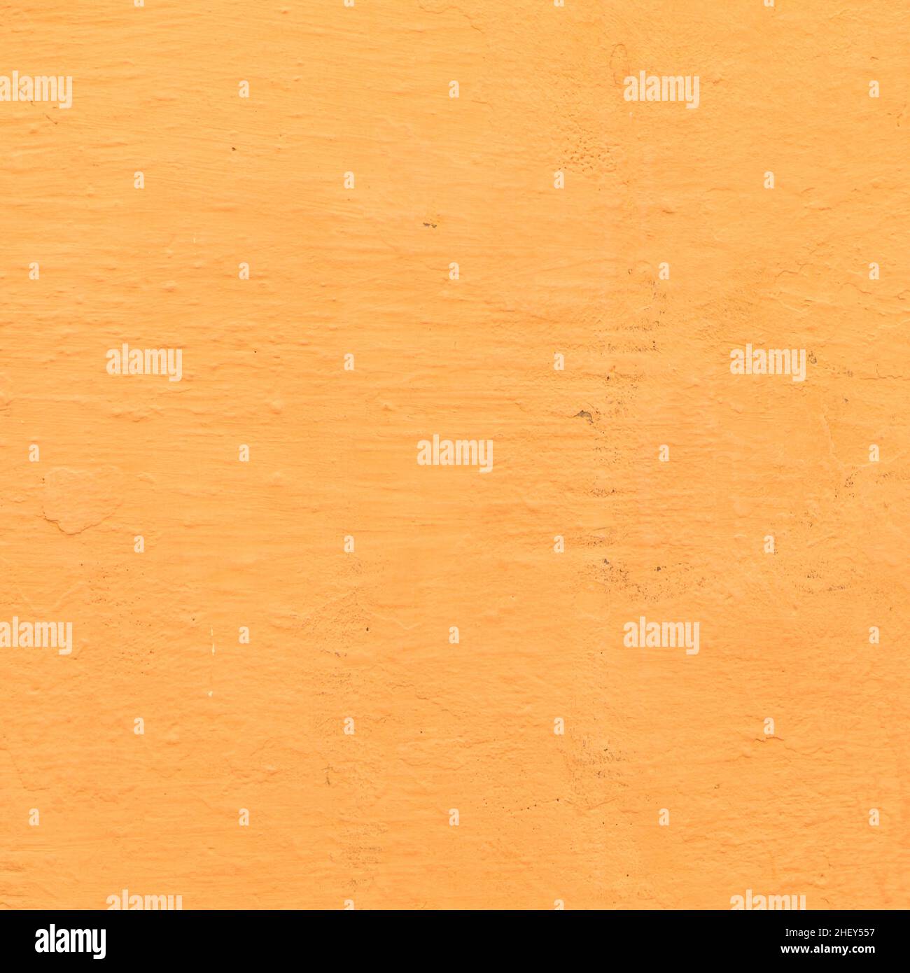 harmonic orange plaster wall background in detail Stock Photo - Alamy