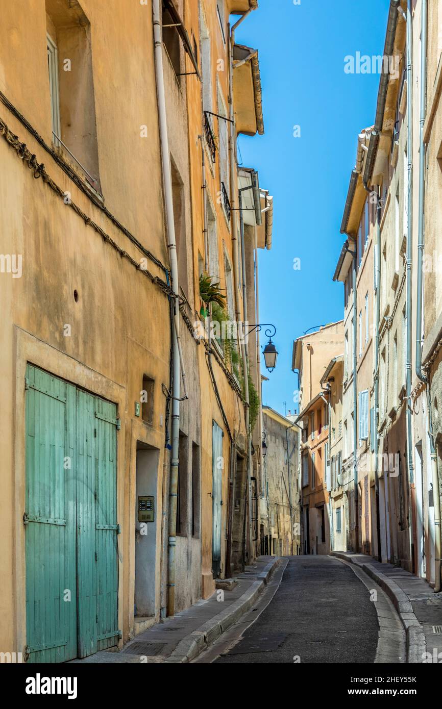 typical small narrow street with facade of old houses in Aix en ...