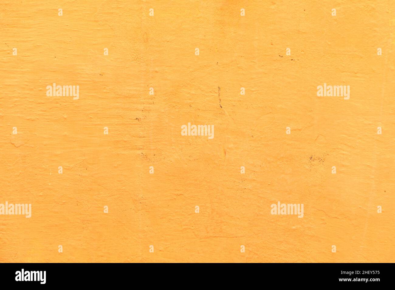 harmonic orange plaster wall background in detail Stock Photo - Alamy