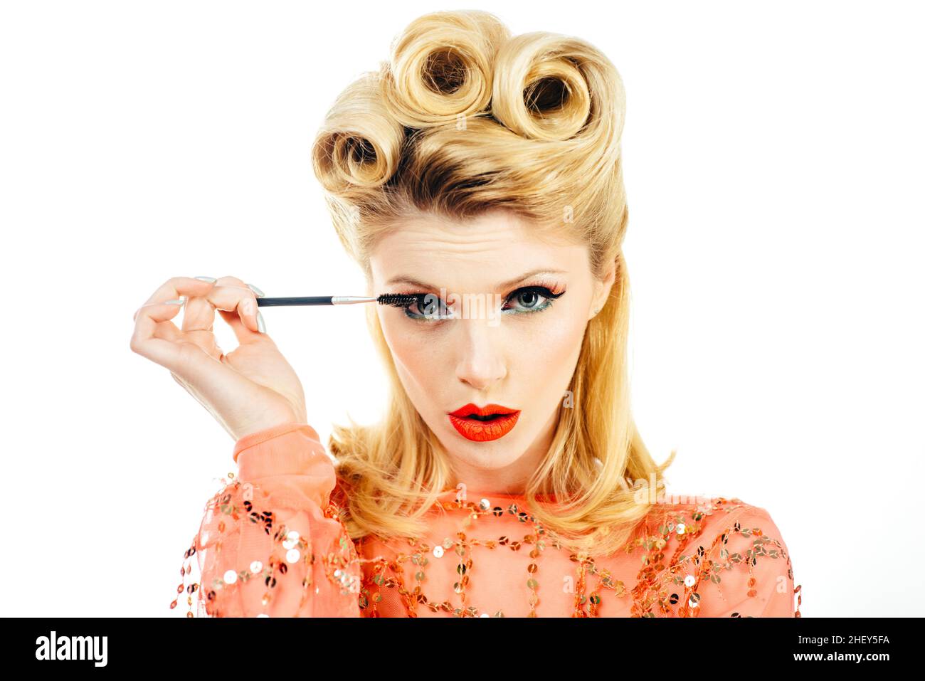 Eyebrow makeup. Beauty blonde model shaping brows with brow pencil ...